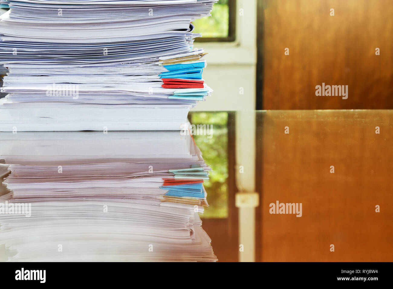 Close up of business papers stack on desk. Pile of unfinished documents ...