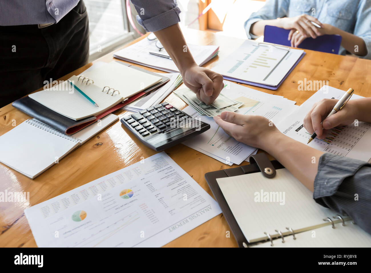 Businessmen discussing together in meeting room. Professional investor ...