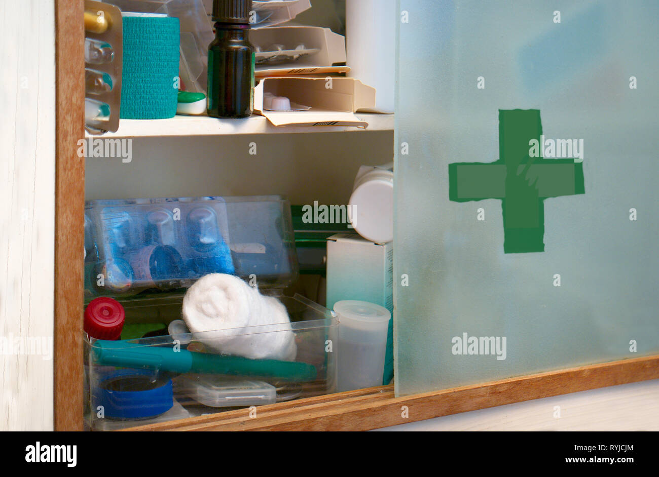 First aid kit in mess inside a shelf with glass door Stock Photo - Alamy