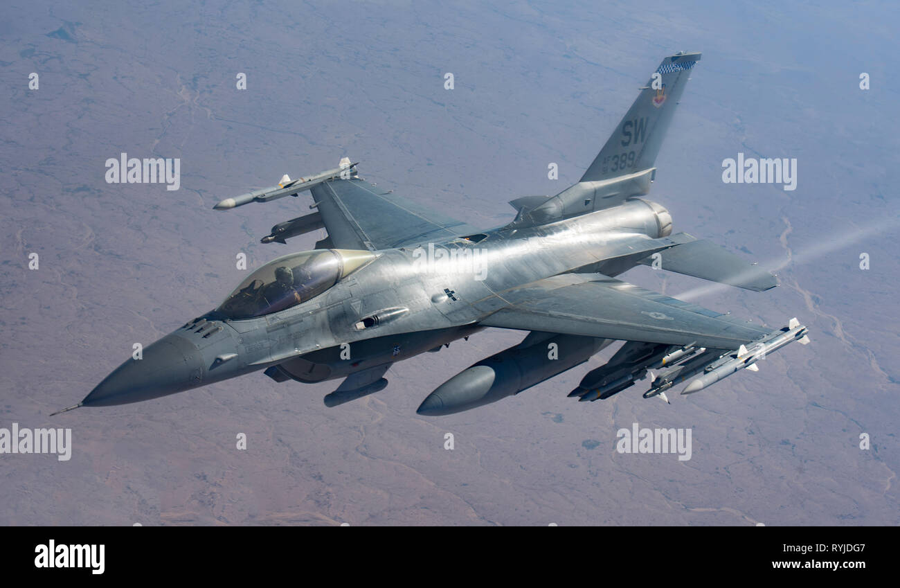 A U.S. Air Force F-16 Fighting Falcon moves into position to get ...