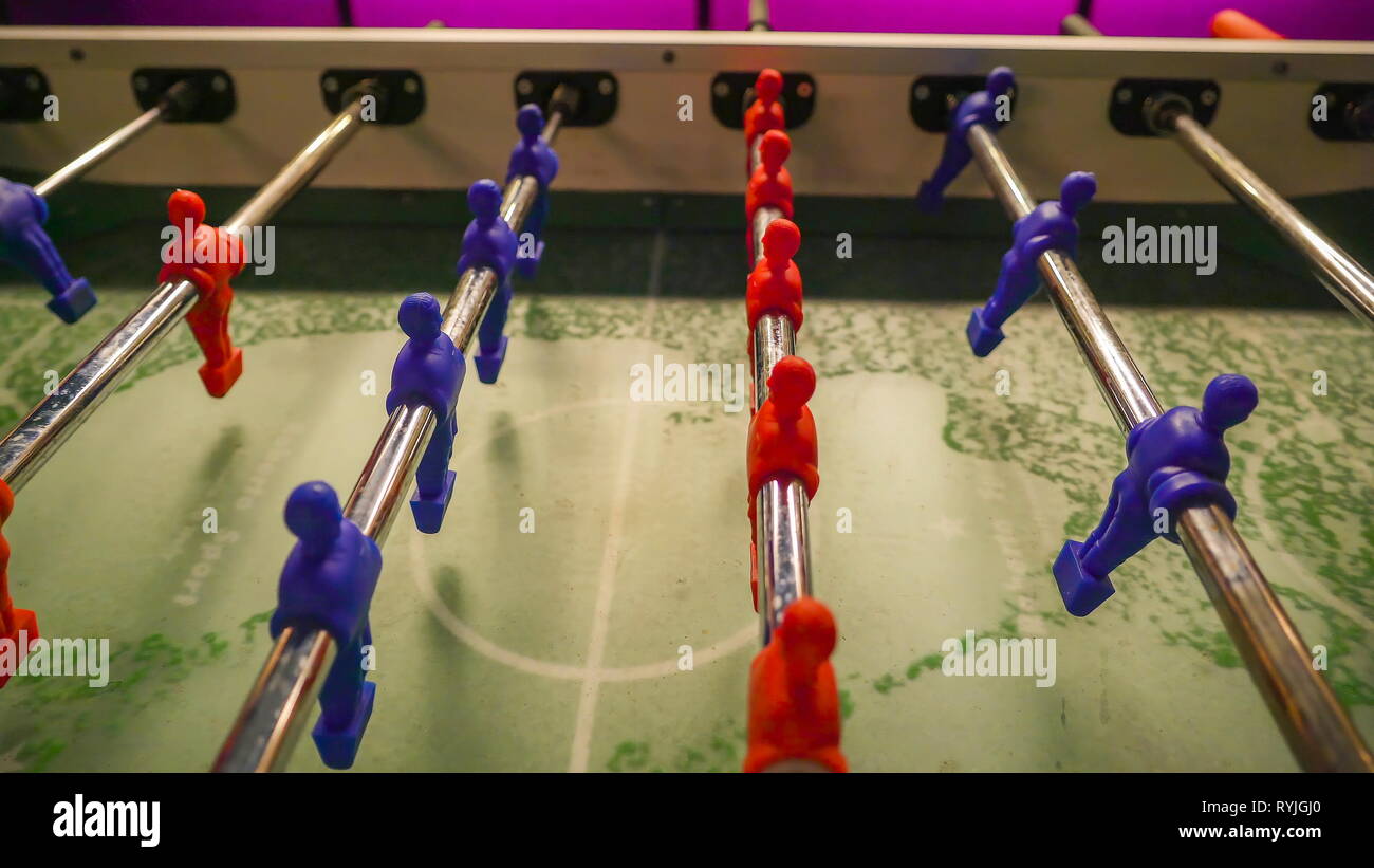Closer look of the red and blue players of the soccer table used ...