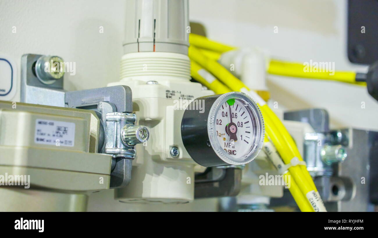 A meter on the tank inside the factory with the big tanks inside Stock ...