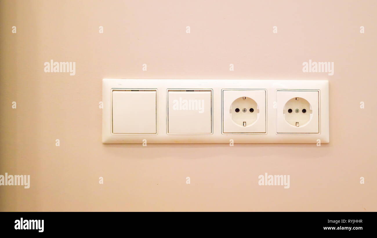 The two outlets on the side of the bed in the room on top of the small ...