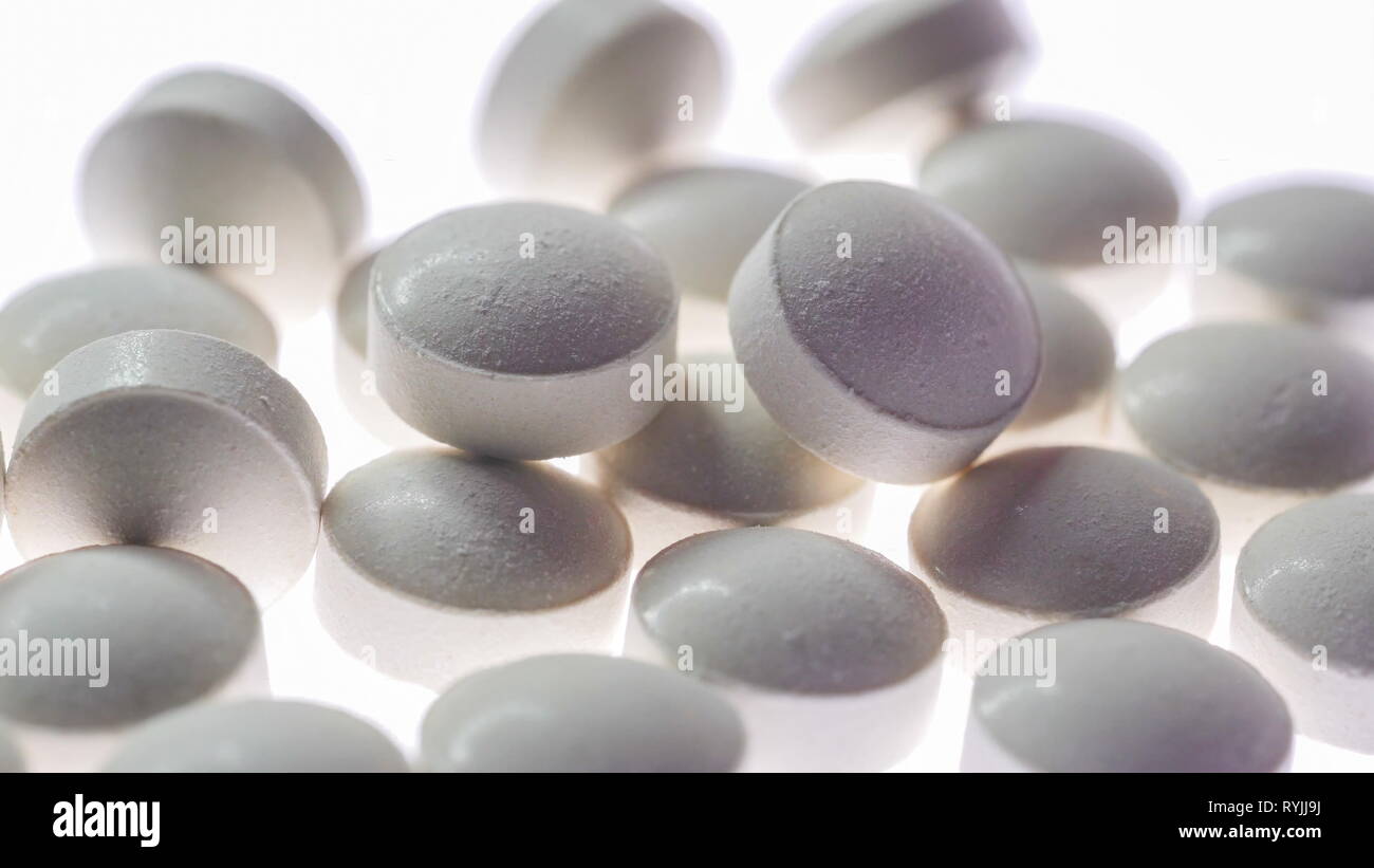 Lots of the medicine tablets on the macro shots with the lines on the ...