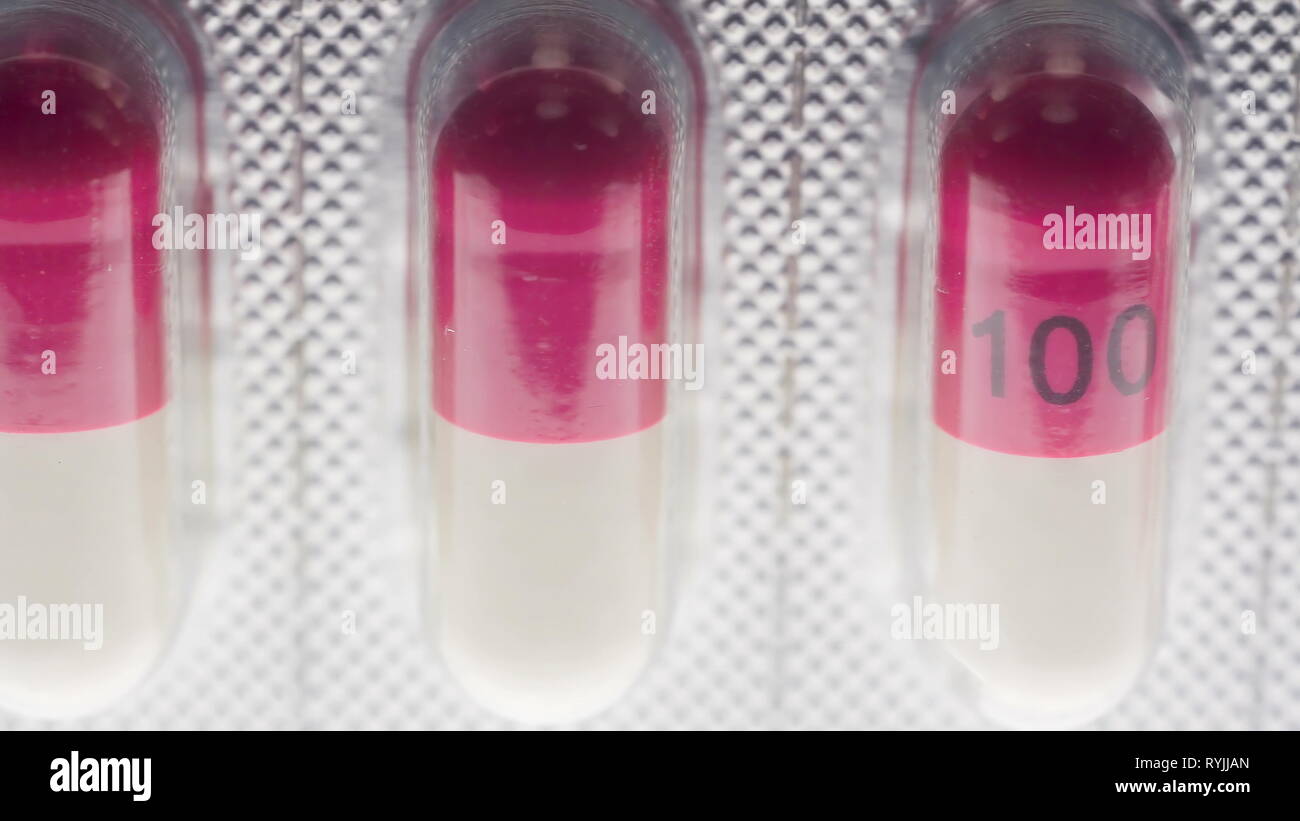 Three capsules inside the plastic on a macro shot from a pack of the ...