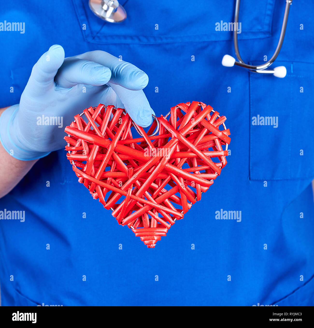 Doctor holds red heart hi-res stock photography and images - Alamy