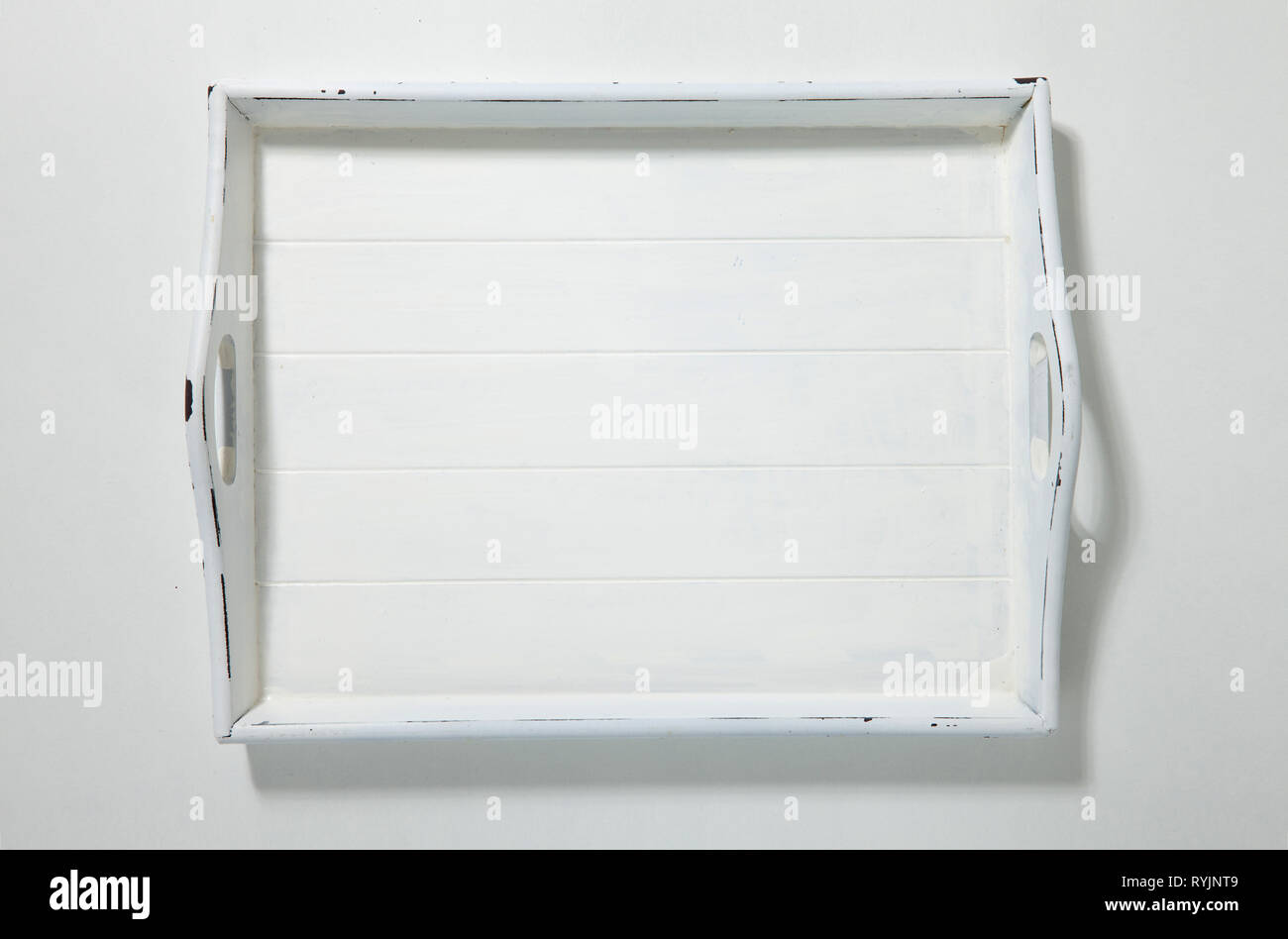 White tray top view macro. Vintage wooden tray with wooden handles ...