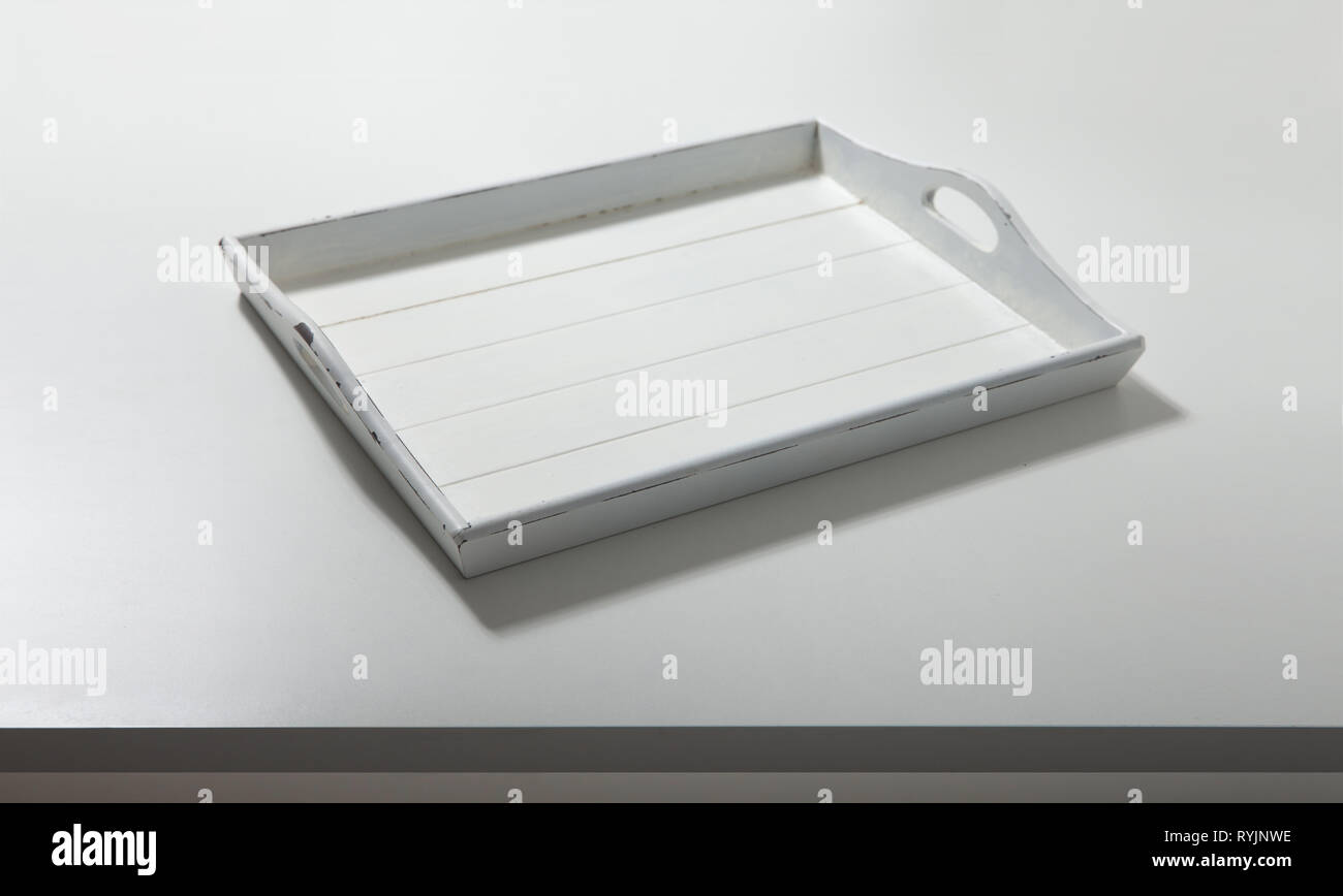 White tray on table top view macro. Vintage wooden tray with wooden ...