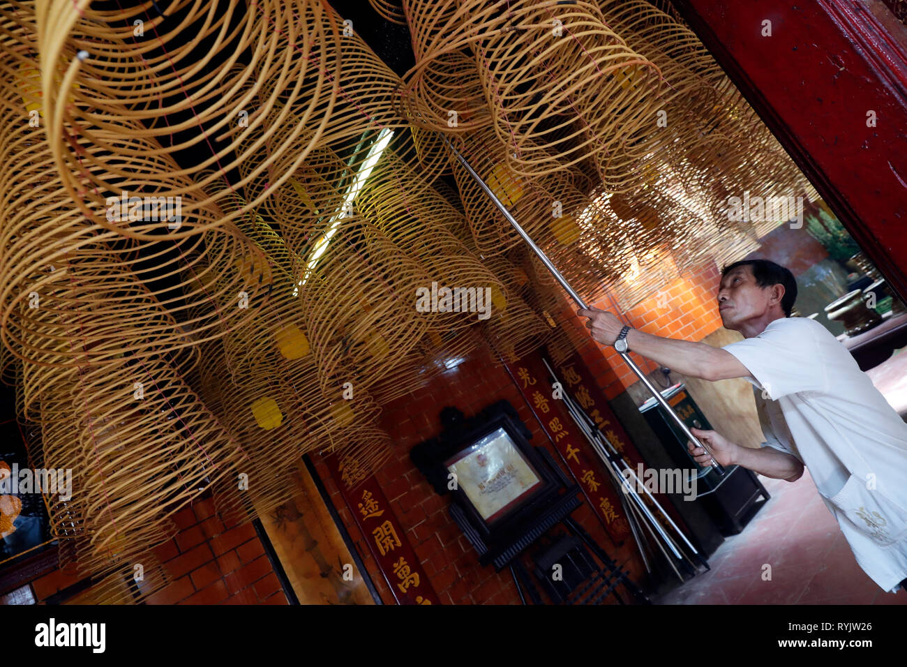 Taoist Ong pagoda. Incense coils hang from the ceiling. Can Tho ...