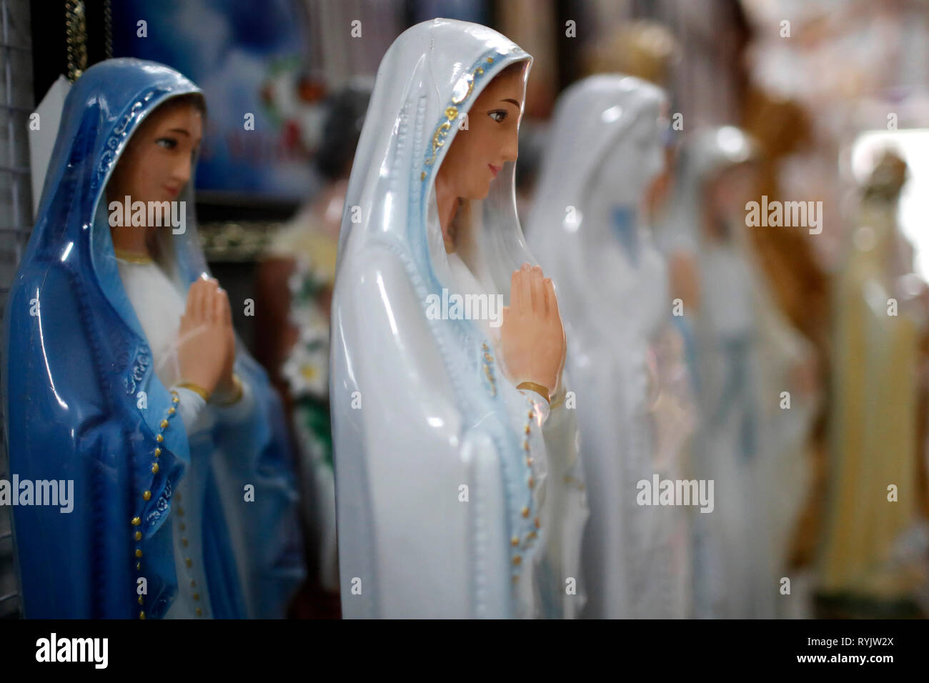 Shop selling religious christian items. Holy Virgin statues. Ho Chi ...