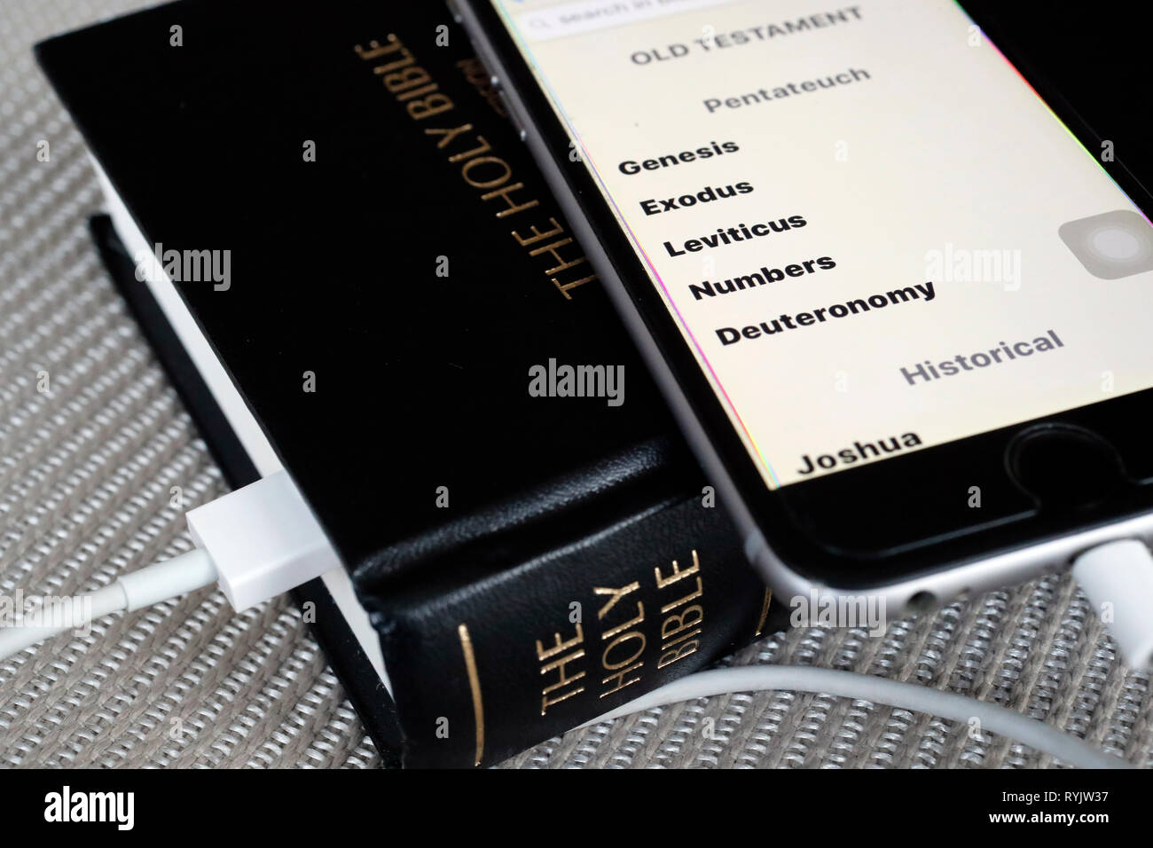 Paper Bible and digital Bible app on smartphone Stock Photo - Alamy