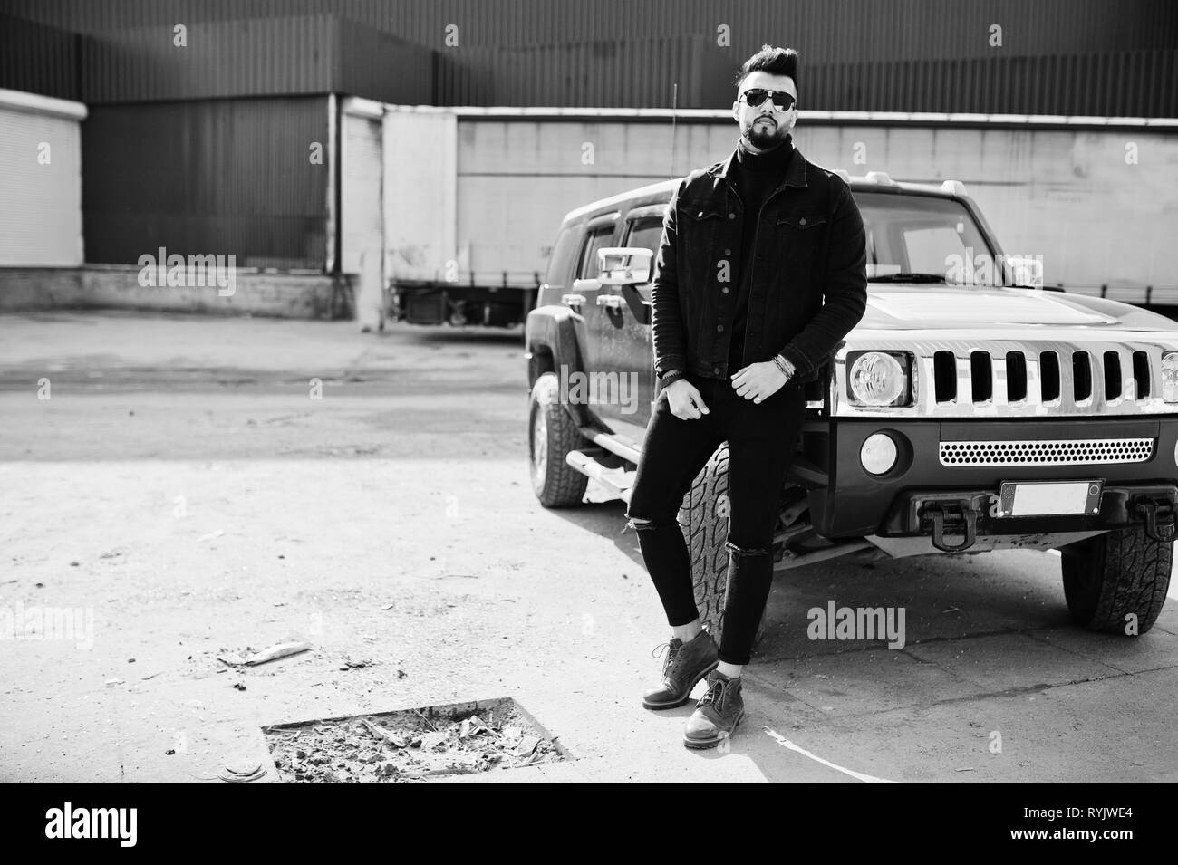 Fashion rich beard Arab man wear on black jeans jacket and sunglasses ...