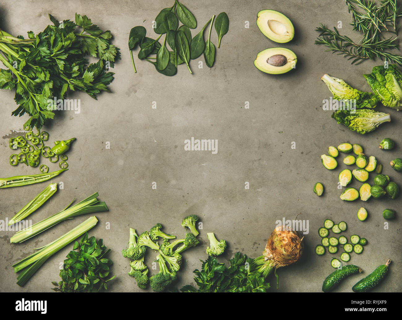 Flat-lay of whole and cut green vegetables and herbs Stock Photo - Alamy