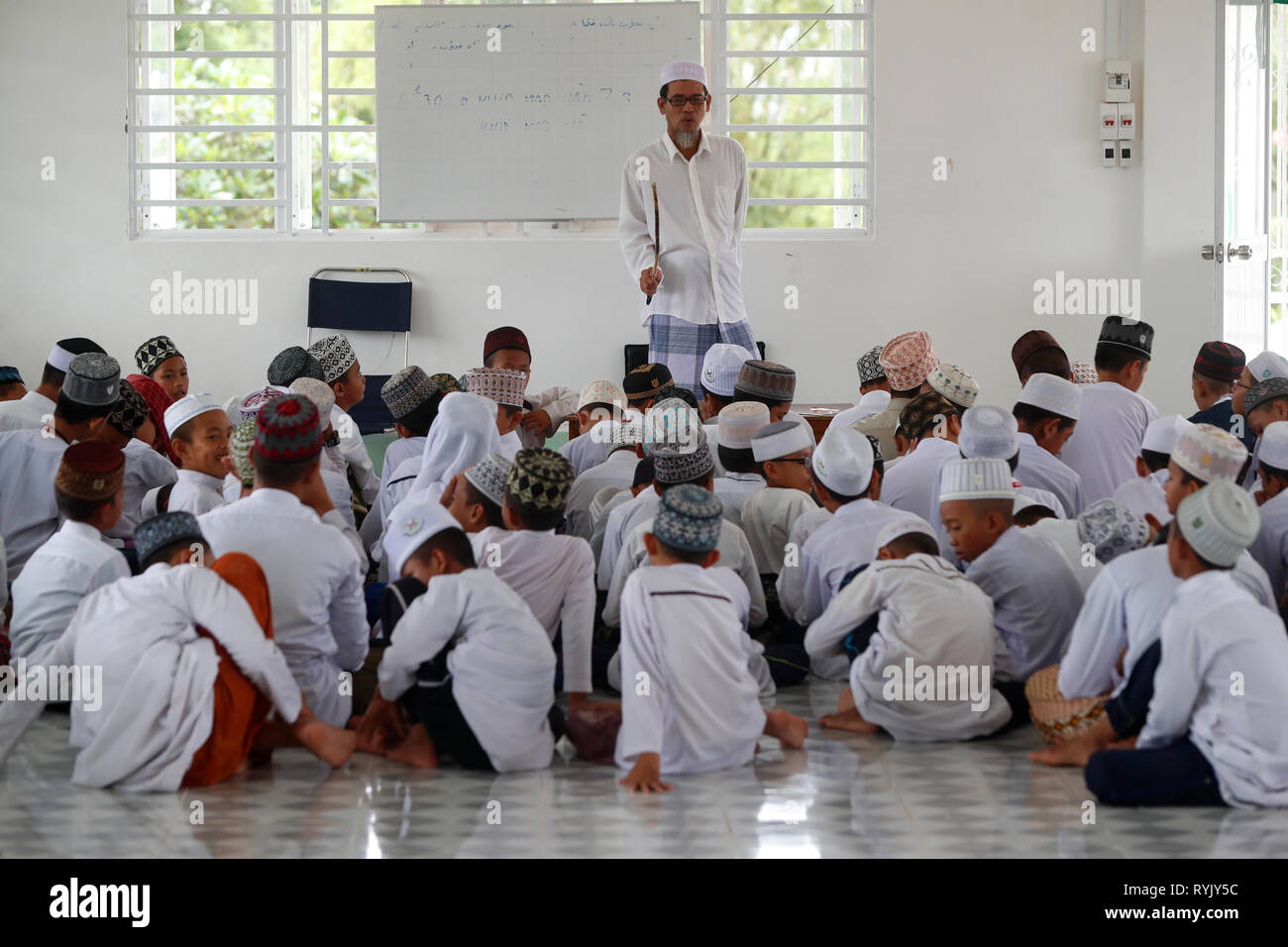 Jamiul Azhar mosque. Muslim children study the Quran at a Madrassa ...