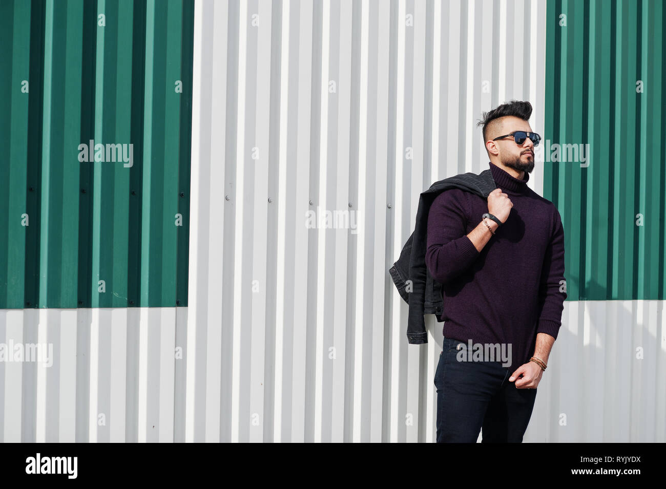 Fashion rich beard Arab man wear on turtle neck and sunglasses posed ...
