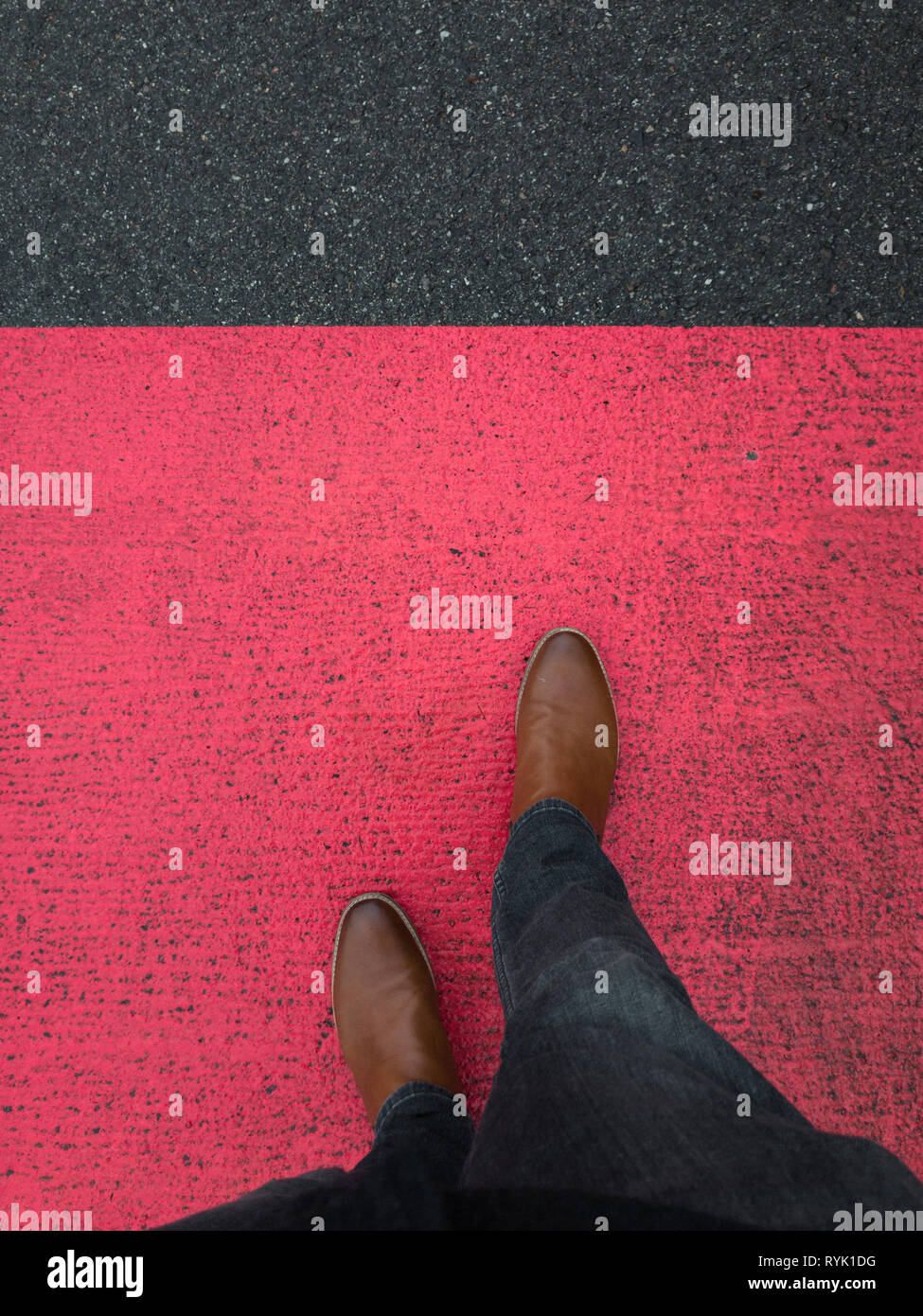 red marking on pavement with leather boot Stock Photo - Alamy