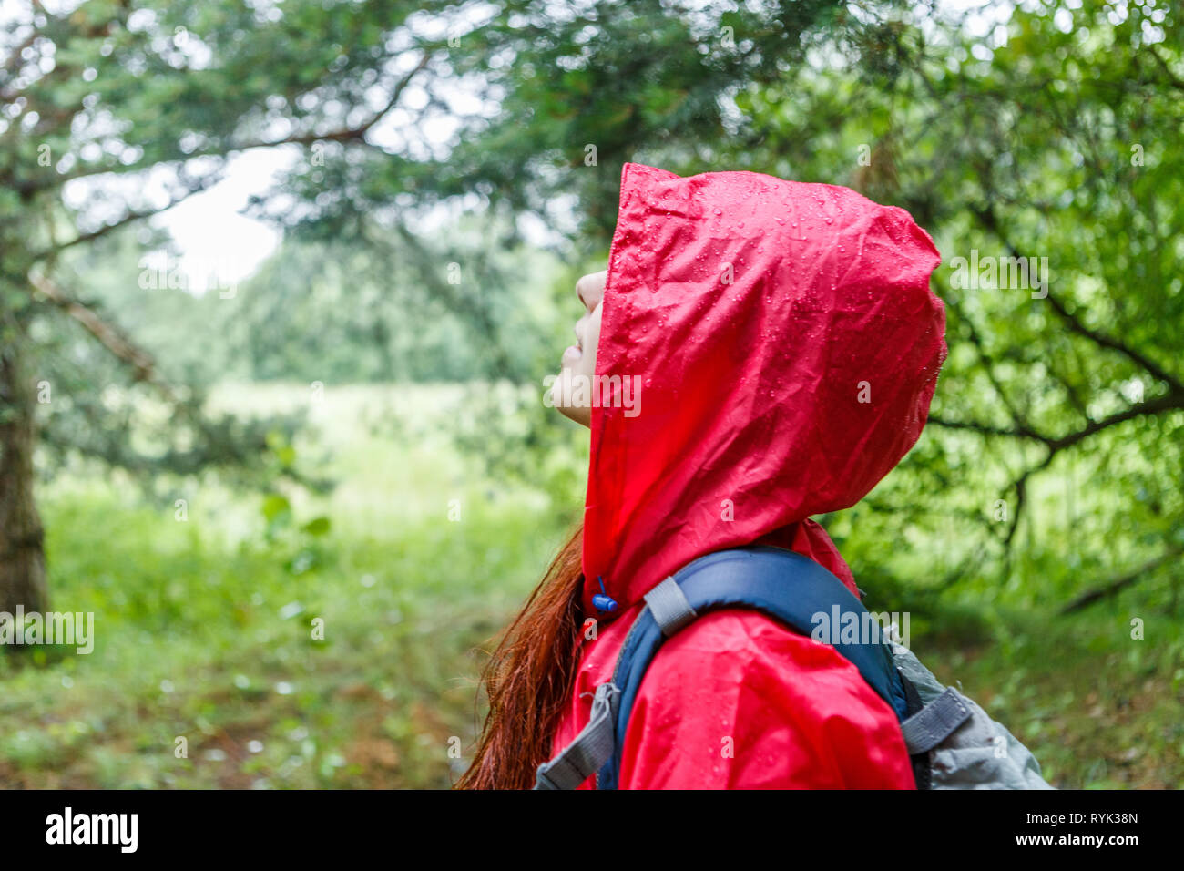 Side view of woman in hood Stock Photo - Alamy