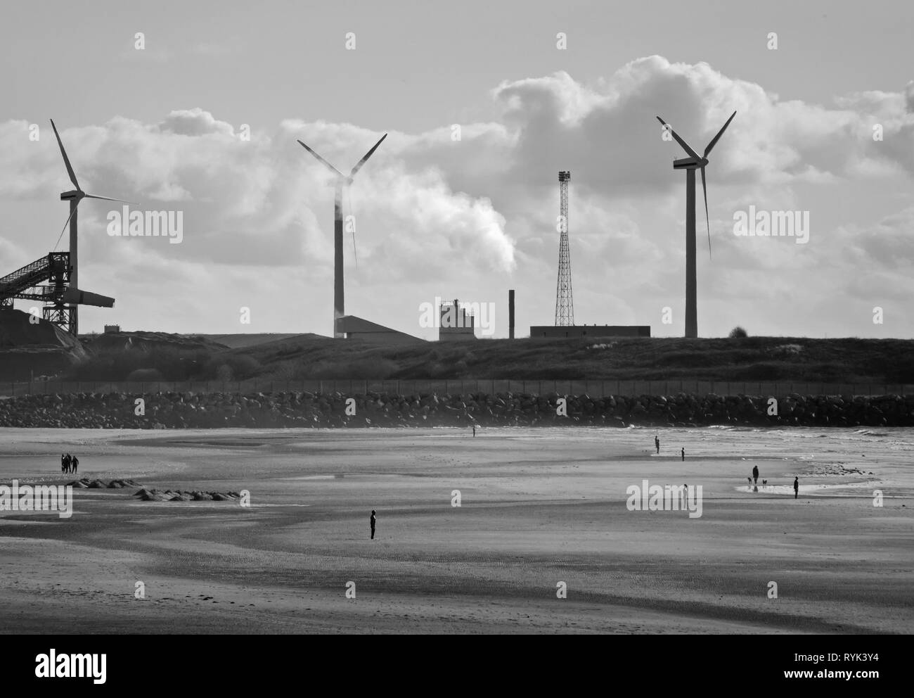 A traditional monochrome view of Formby beach, with the distant wind ...