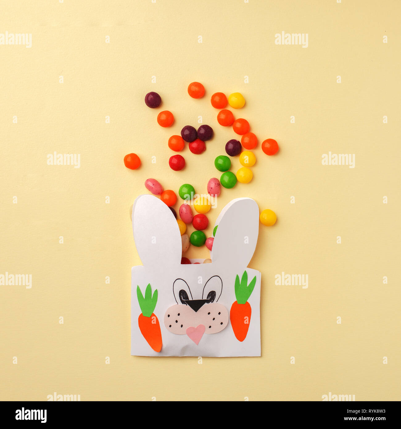 Easter colorful candy and Jellybean flowing from party paper handcraft ...