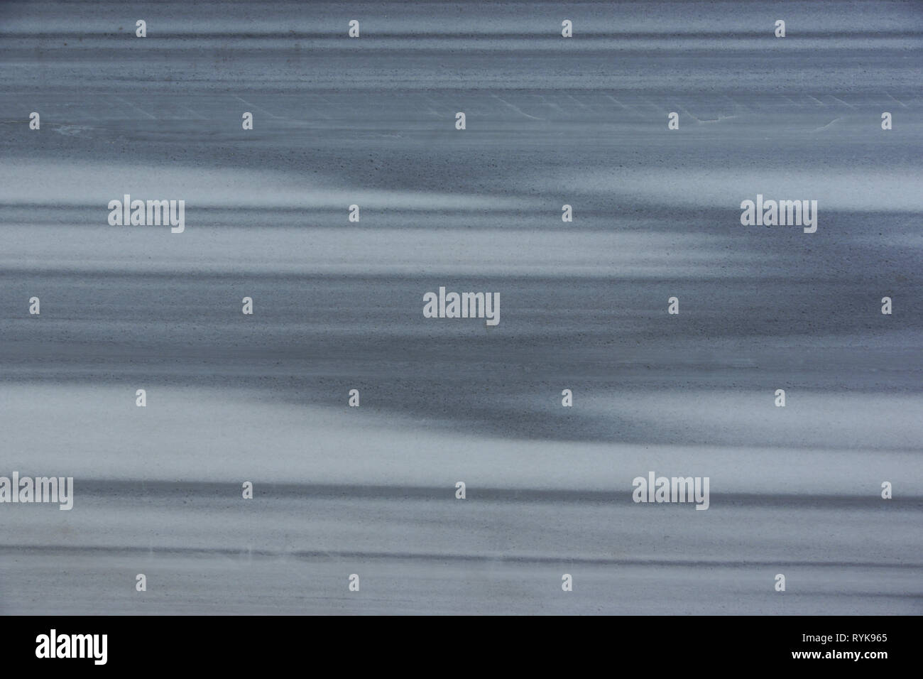 White marble stone with gray parallel stripes resembling a zebra is ...