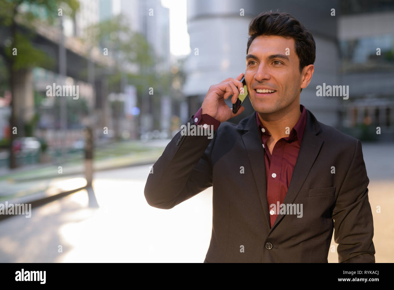 Happy hispanic businessman thinking using hi-res stock photography and ...