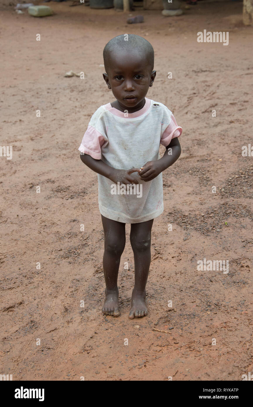 Anekro, ivory coast – August 20, 2015: Innocent African child, barefoot ...