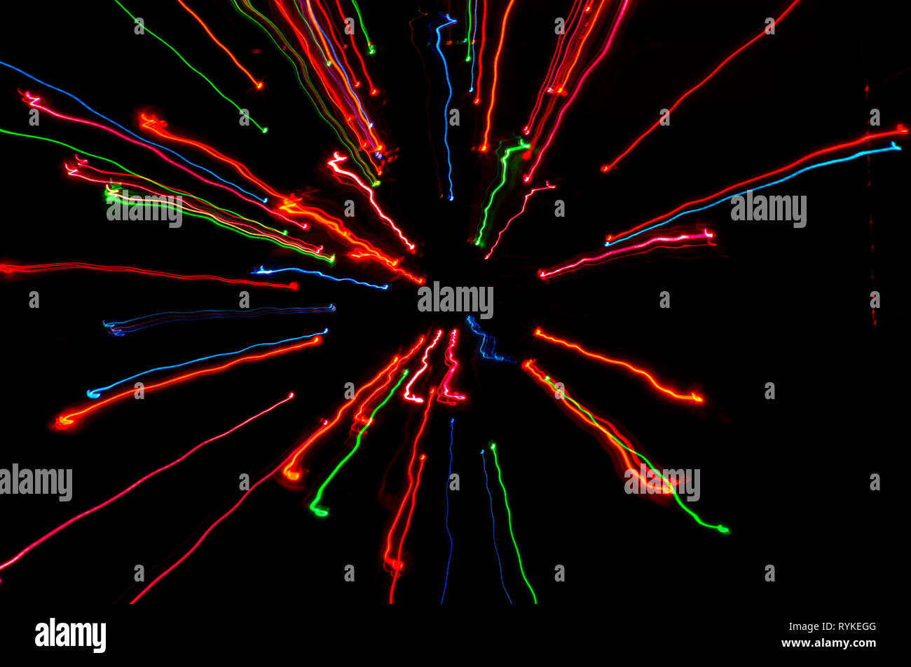 Abstract Colorful streaks of light moving to center Stock Photo - Alamy