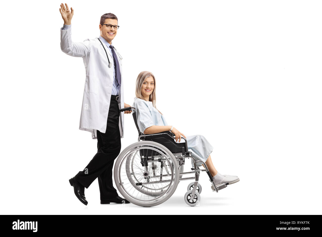 Full length shot of a young male doctor waving and pushing a female ...