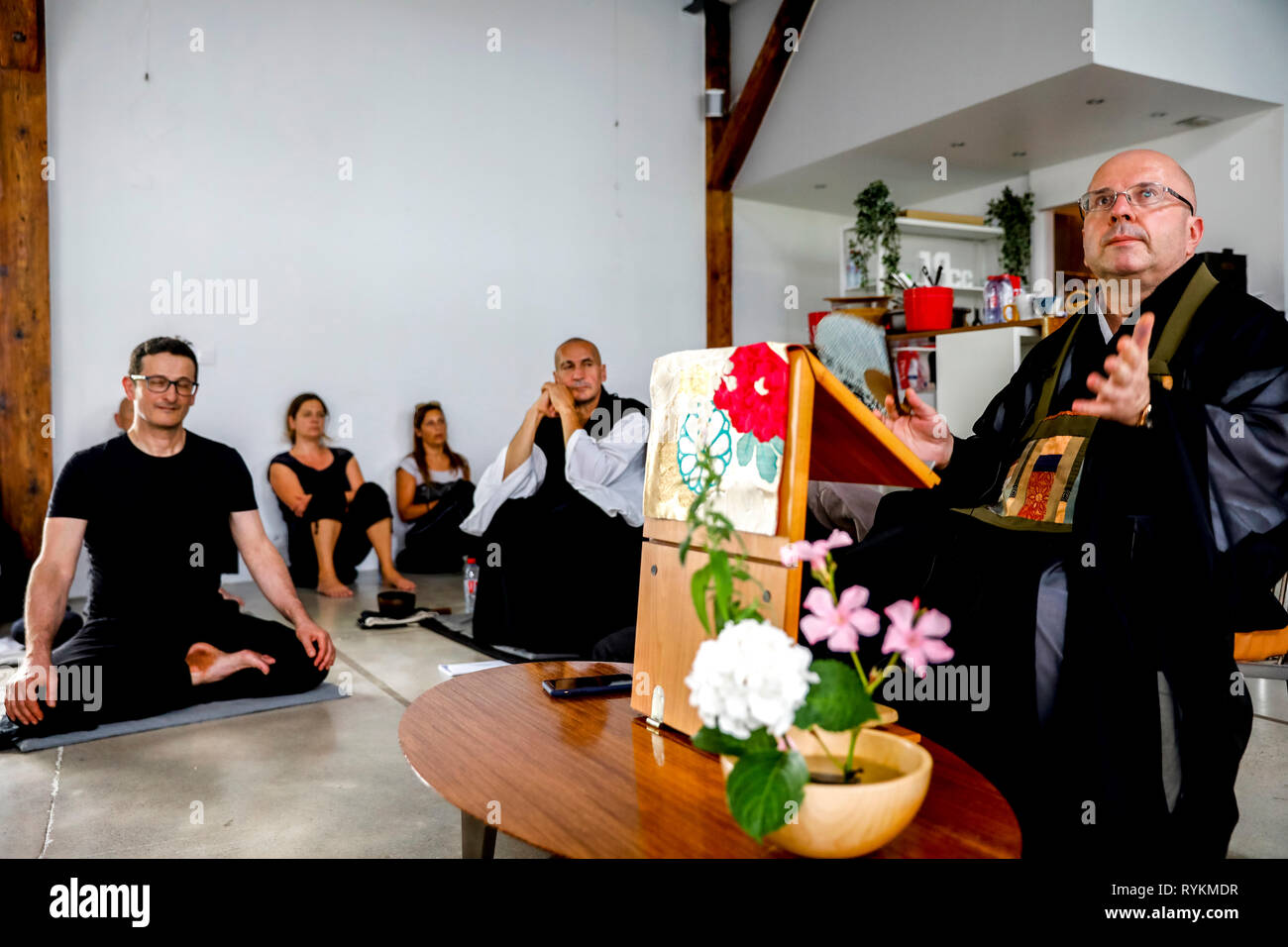 Zen sesshin (retreat) in Paris, France. Master giving a lecture Stock ...