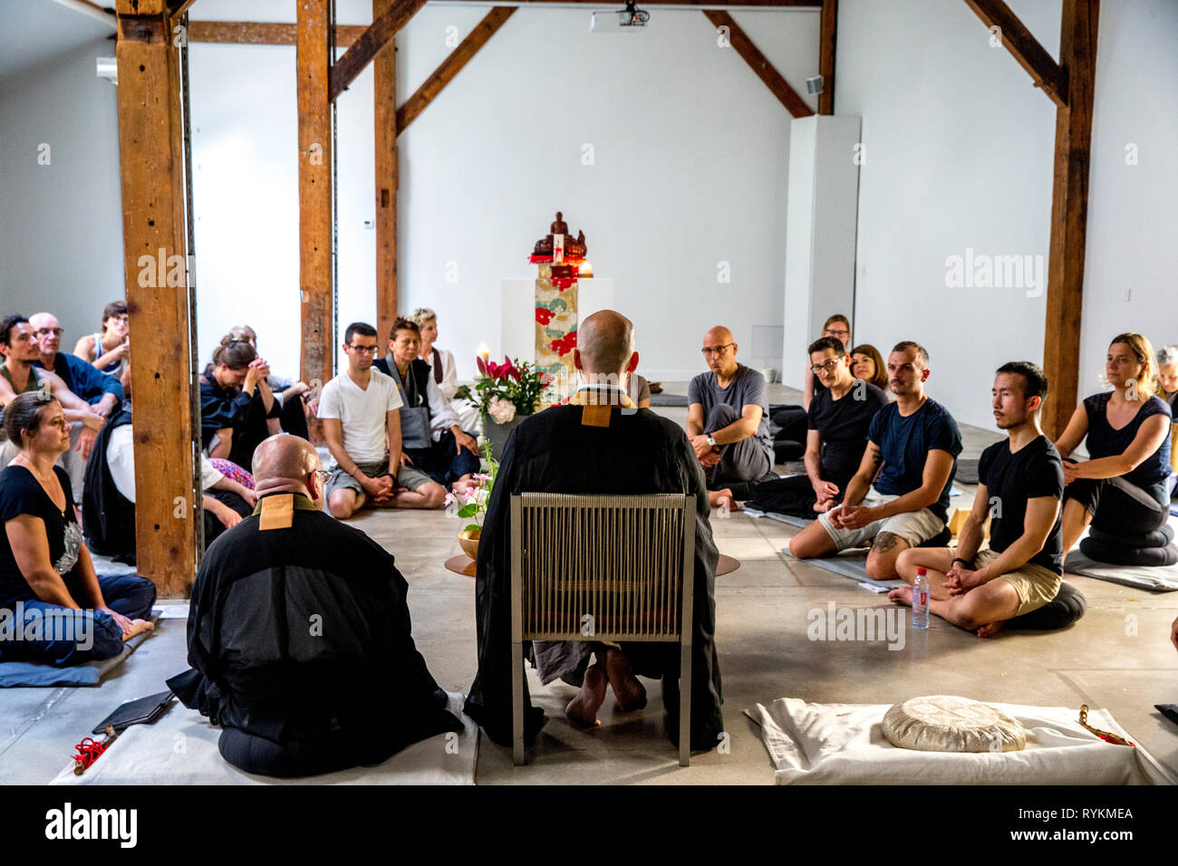 Zen sesshin (retreat) in Paris, France. Master giving a lecture Stock ...