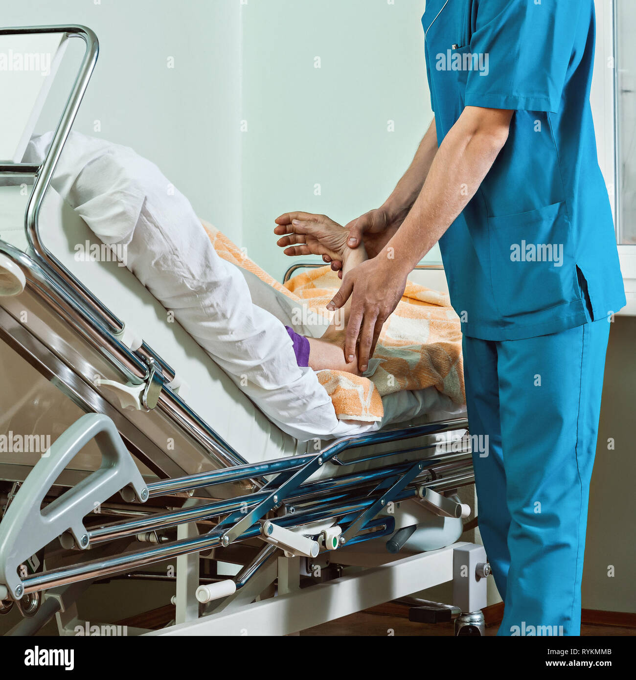doctor checks the pulse of a patient Stock Photo - Alamy