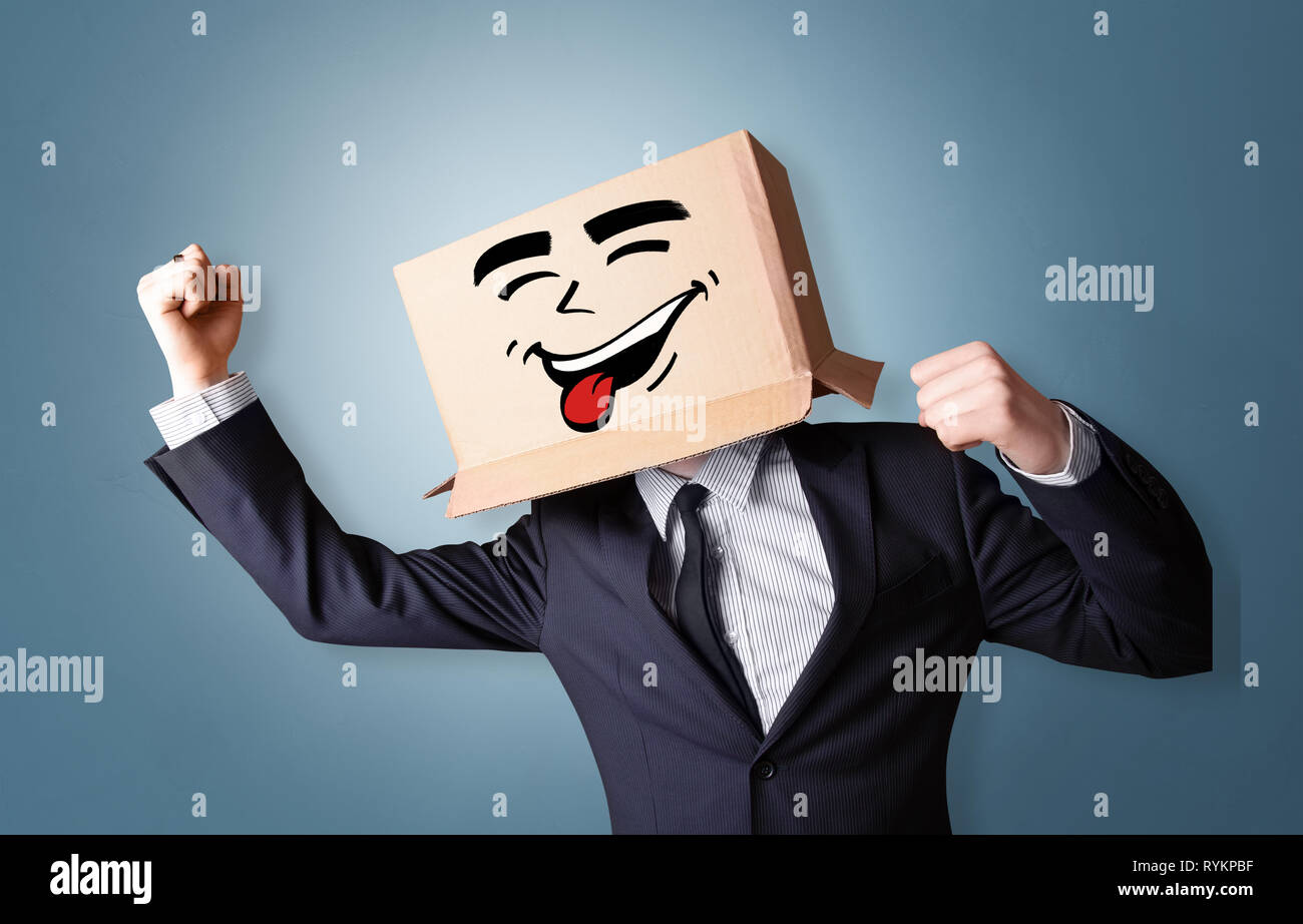 Young boy standing and gesturing with a cardboard box on his head Stock ...