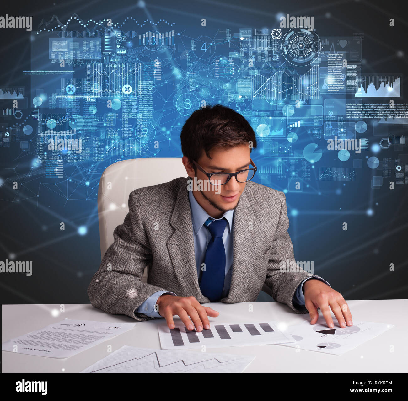 Young manager at the office making report and statistics Stock Photo ...