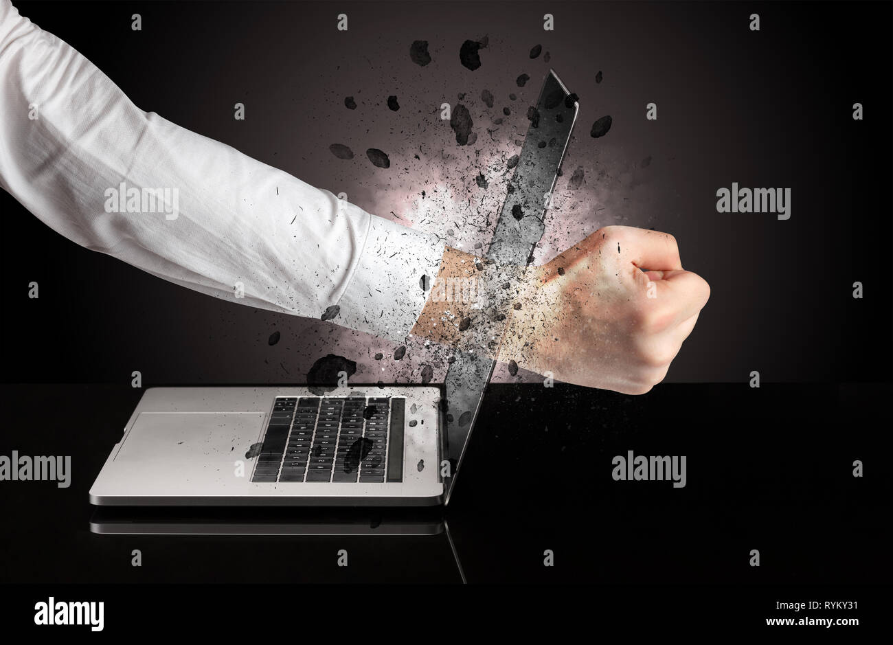Strong male hand breaks laptop screen glasses Stock Photo - Alamy
