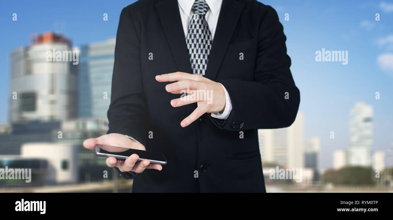 Businessman Holding Smartphone in Hand With Hand Gesture Over The ...