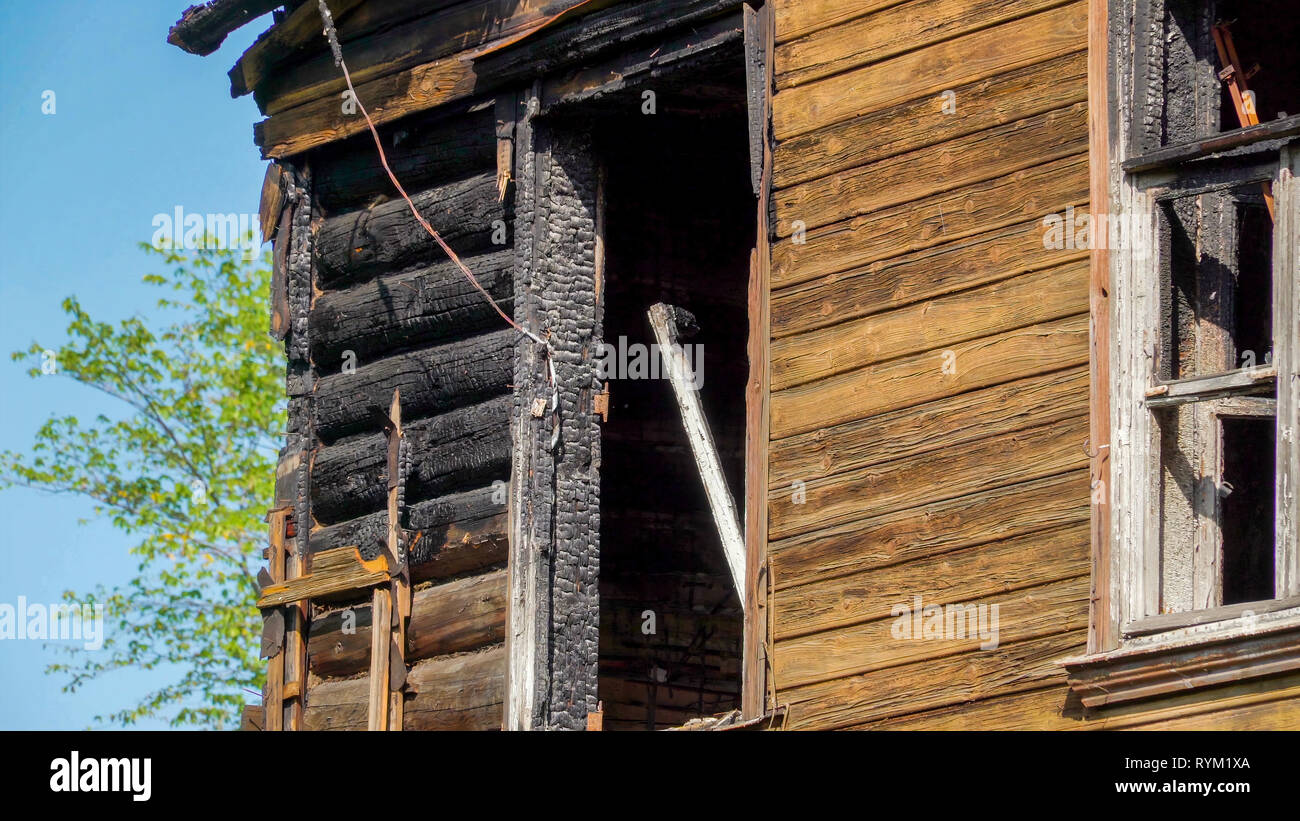 The wooden lumbers of the house from the fire with the black ashes on ...
