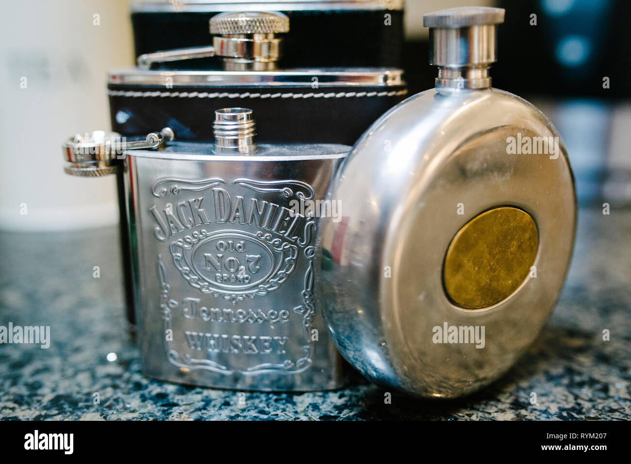 a close up selection of men's hip flasks Stock Photo - Alamy