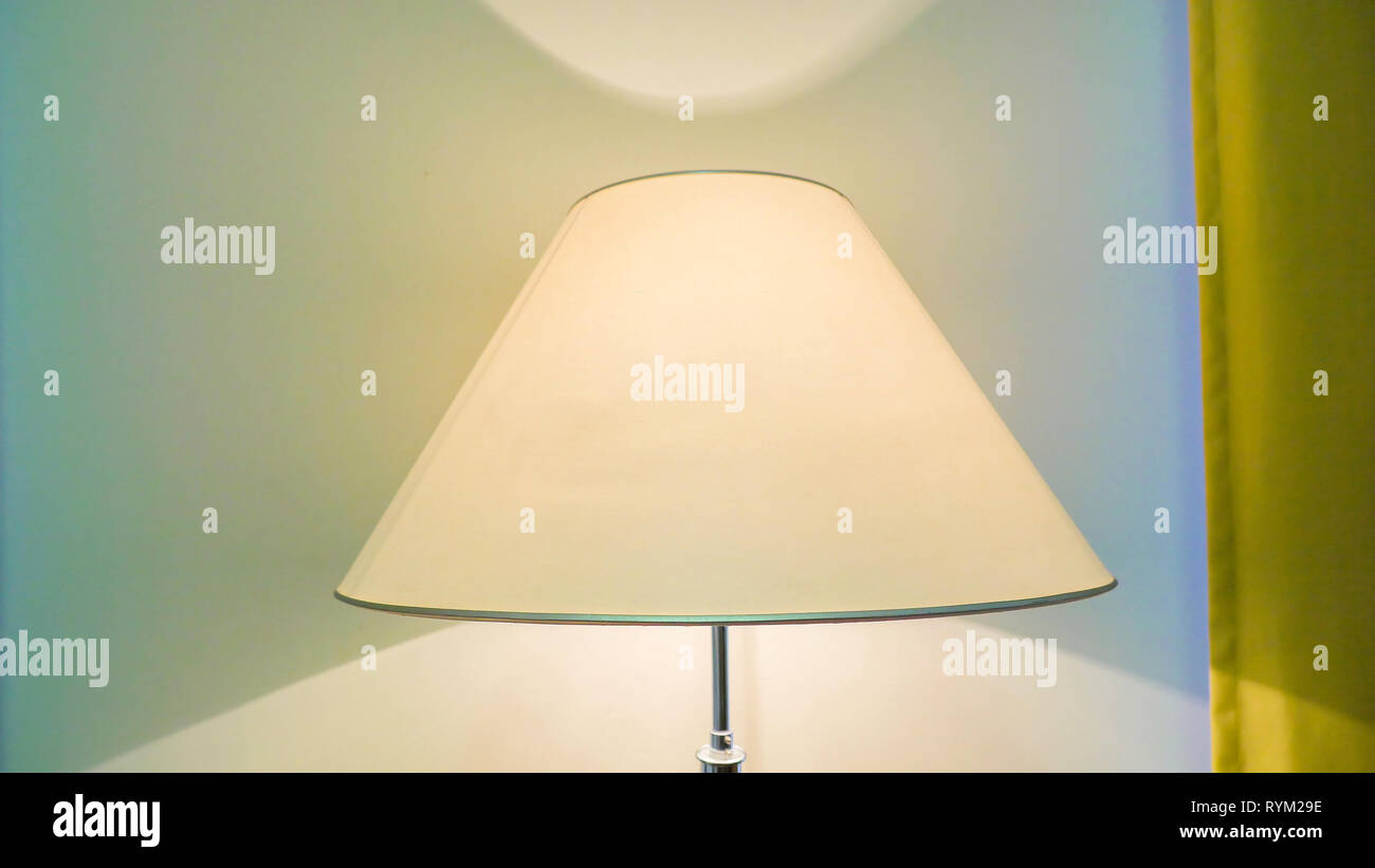 Under the hat of the lampshade in the bedroom with the bulb turned on ...