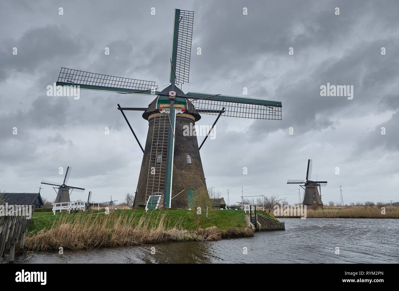 Windmills in a cloudy and windy day - South holland - Group of 19 ...