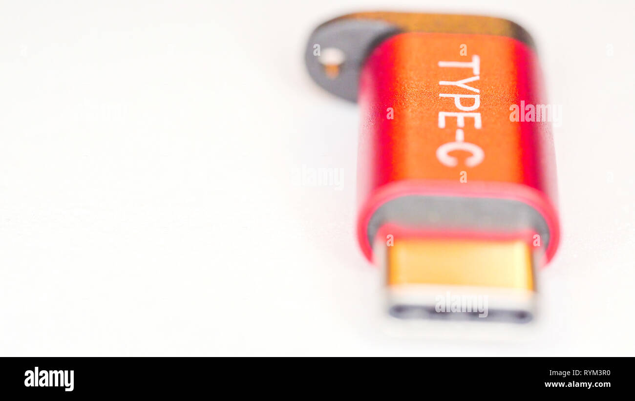The Type C USB-C micro adapter port on the table that is red in color ...