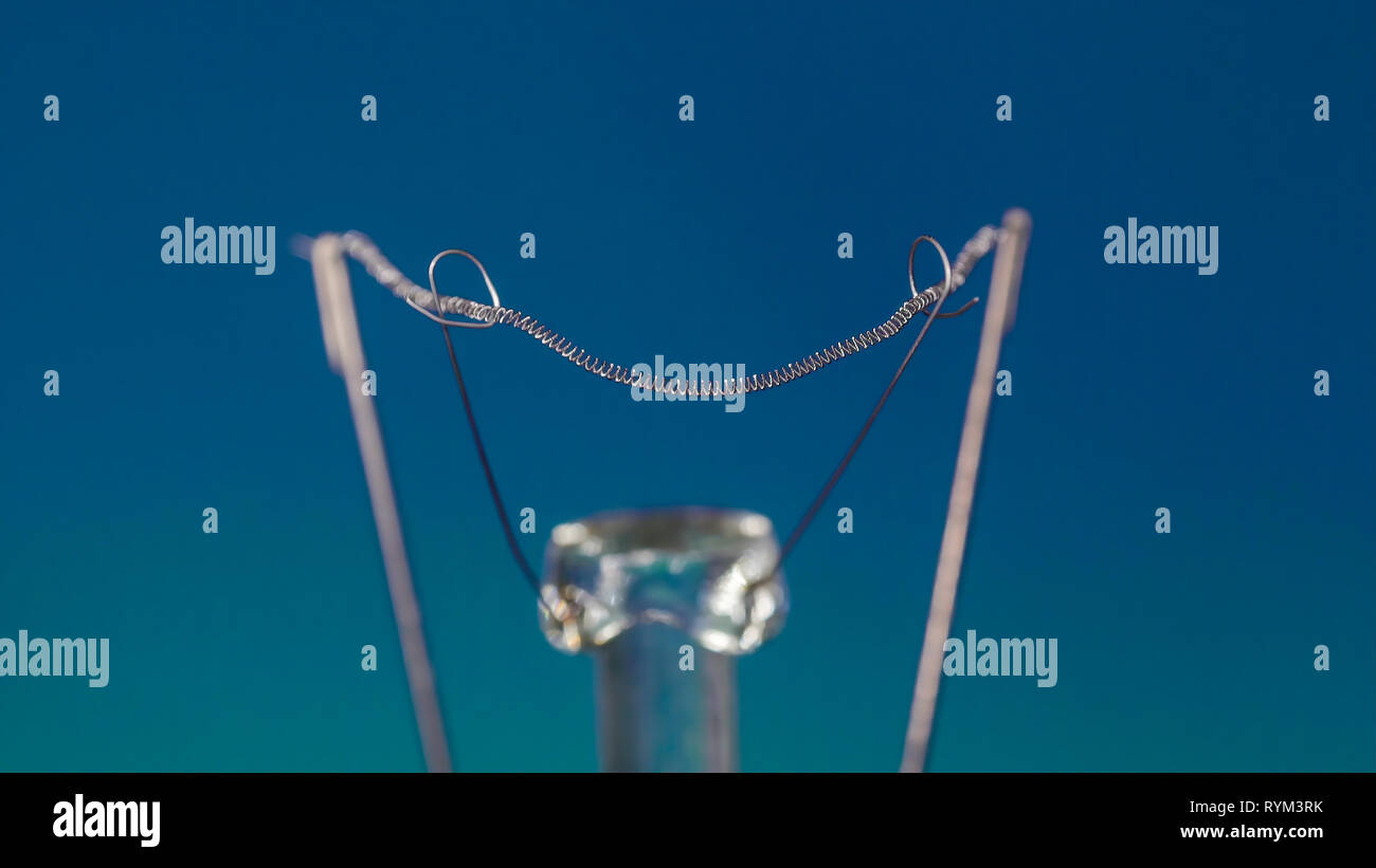 Macro shot of the wires inside the bulb where the electricity runs ...