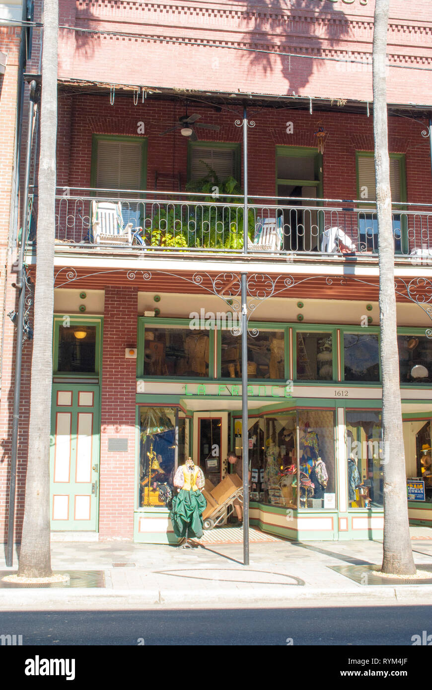 French clothes shop at Avenue in the old city. The delivery worker ...