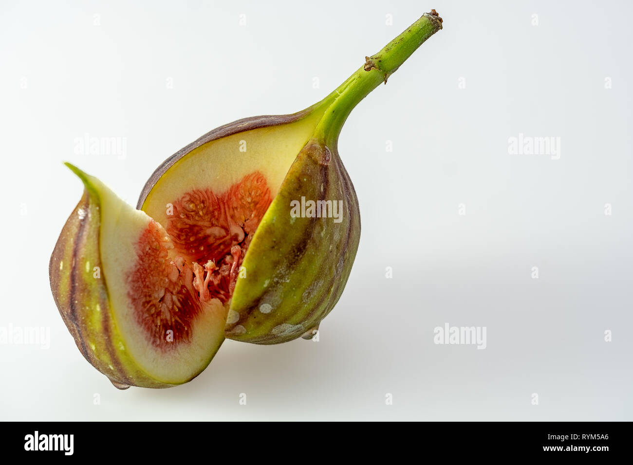 cut fig in front of white background Stock Photo - Alamy