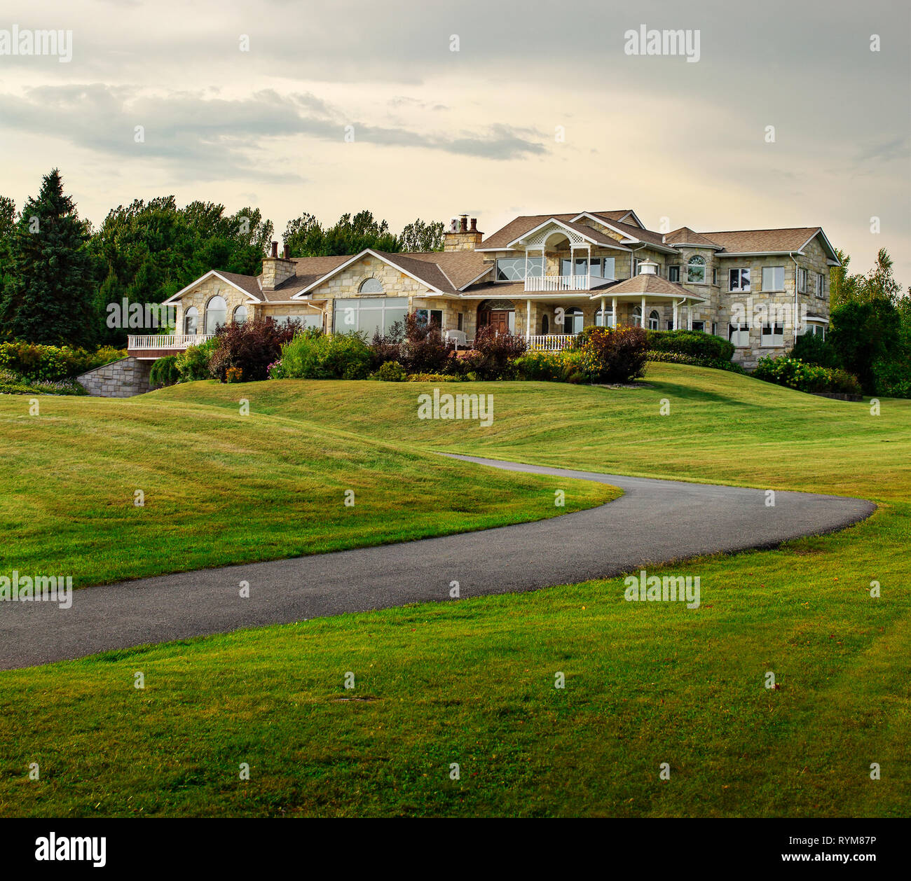 Large Rural Canadian Home, with large well kept lawn, tree line ...