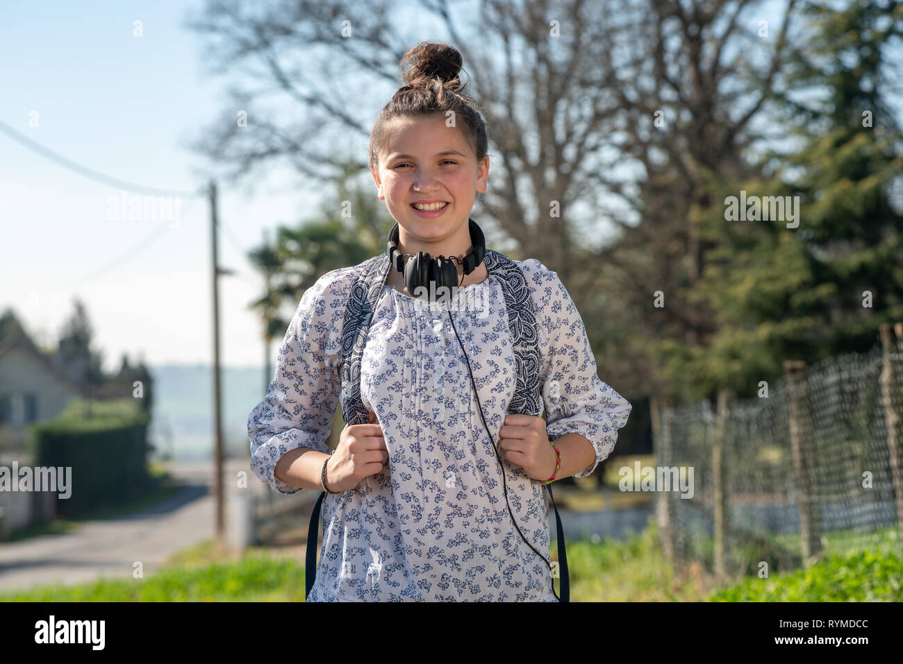 a young teenager girl waiting the school bus Stock Photo - Alamy