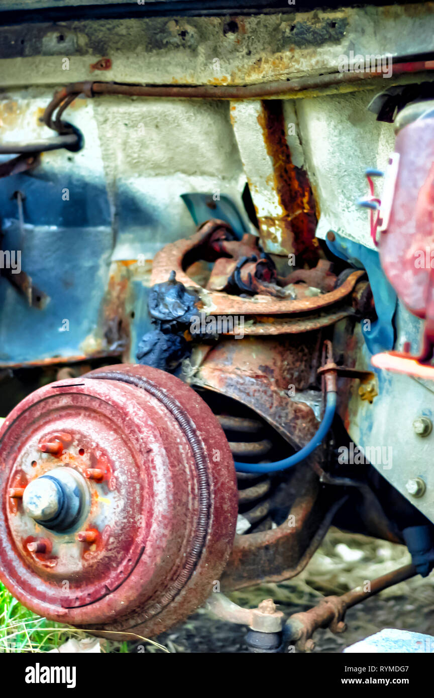 Close up shot of the rusting wheel hub of a Lincoln Continental car ...