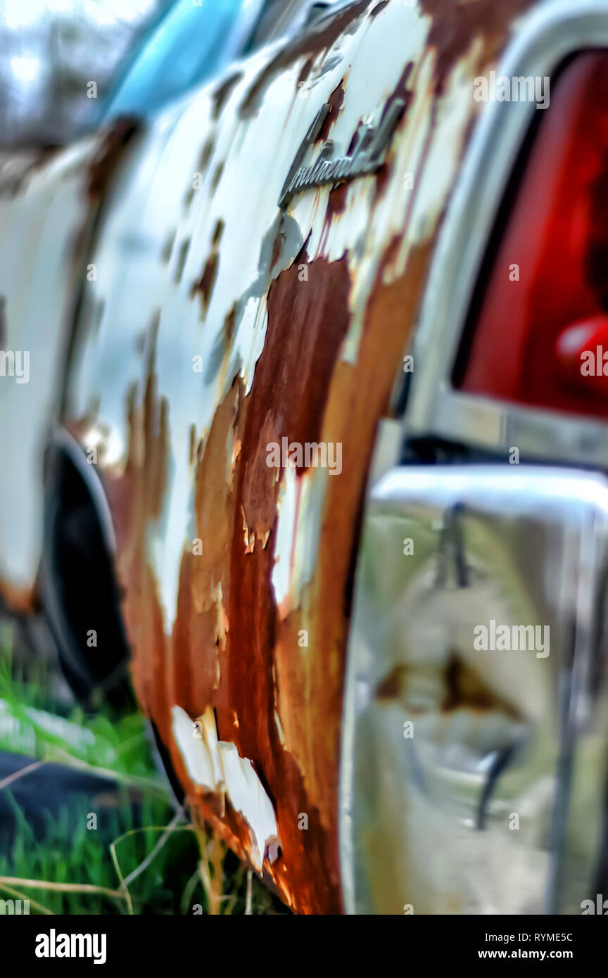 Close up image of an abandoned and rusting Lincoln Continental car ...