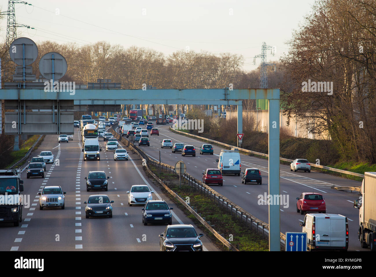 Numerous cars driving on highway in a traffic jam. Vehicle junction on ...