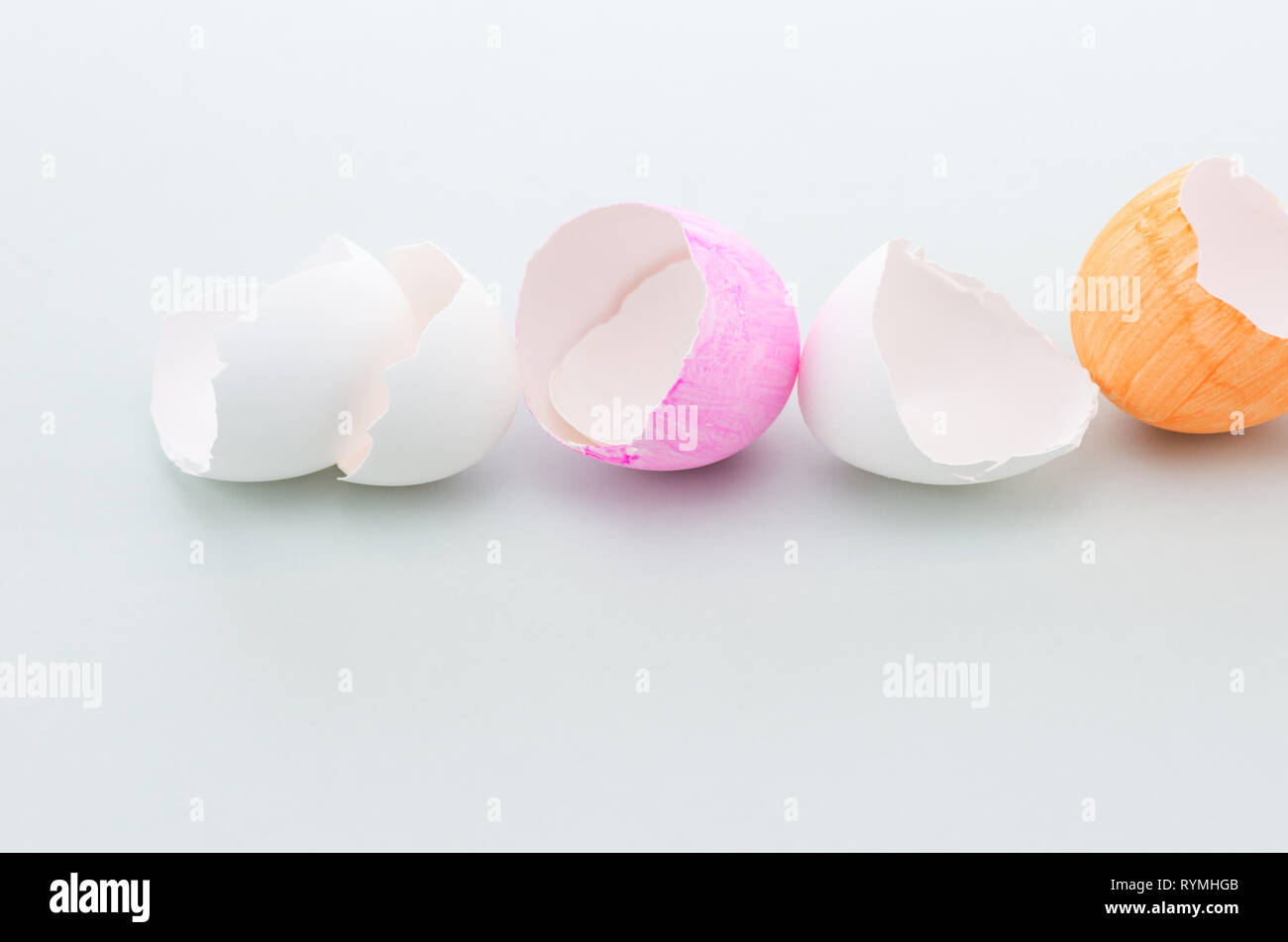 white empty broken egg shells with colored ones Stock Photo - Alamy