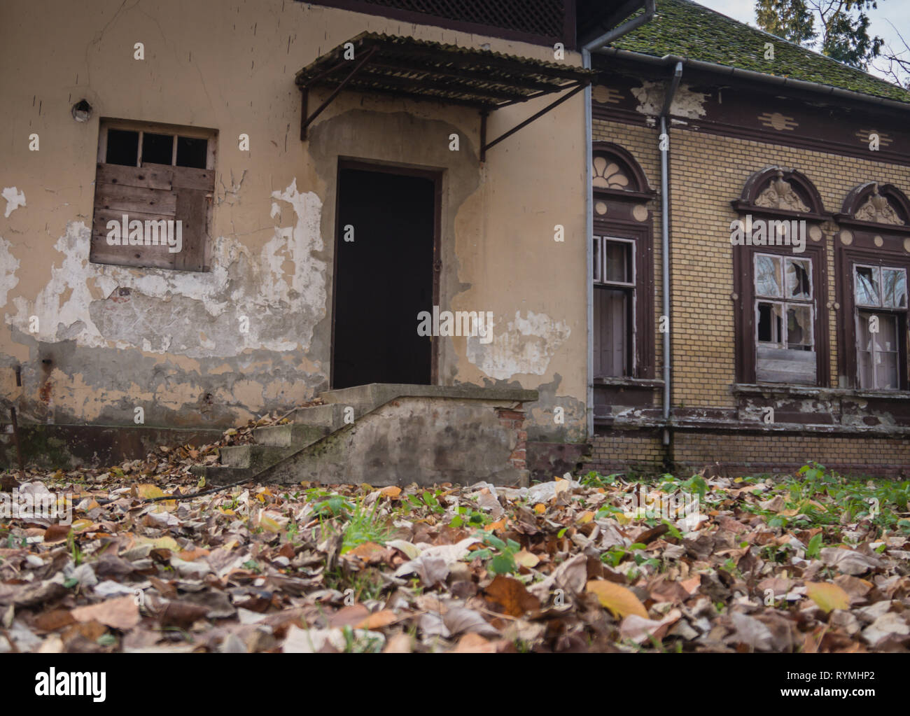 Old building in park at the fall time, rustic and falling apart from ...